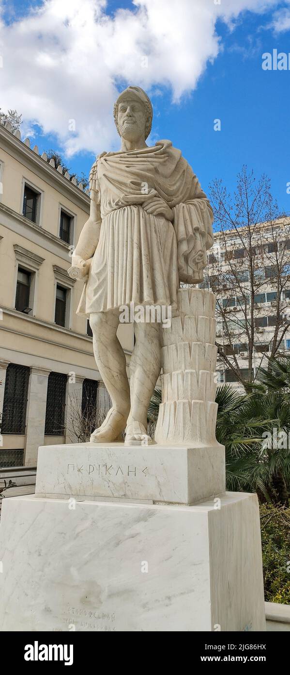 A vertical shot of a white sculpture of Pericles in Greece in a park ...