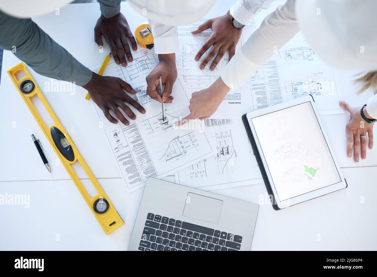 So proud to have you all around. Shot of team of architects planning ...