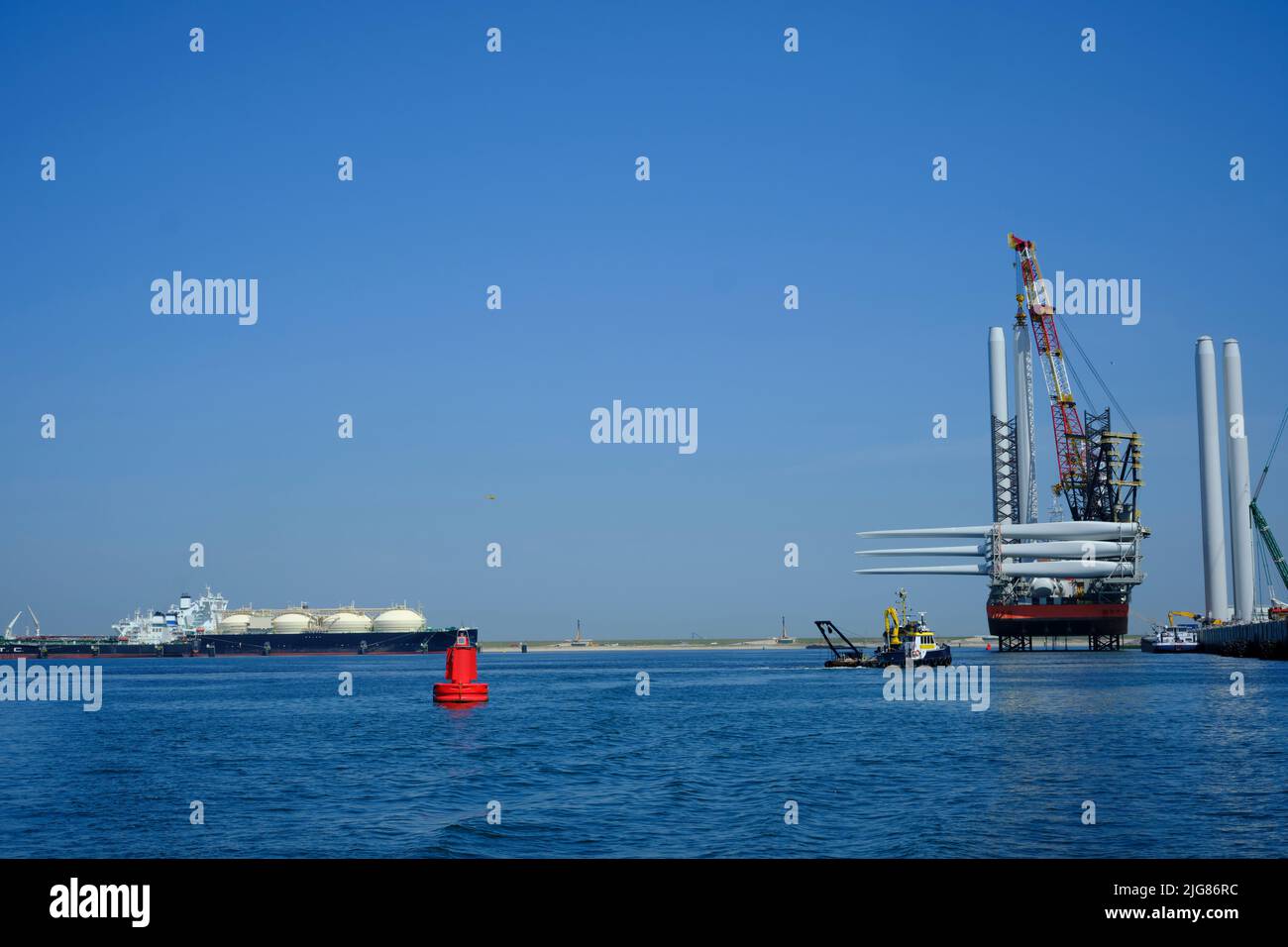 A large offshore vessel with a crane and a helipad is moored in the ...