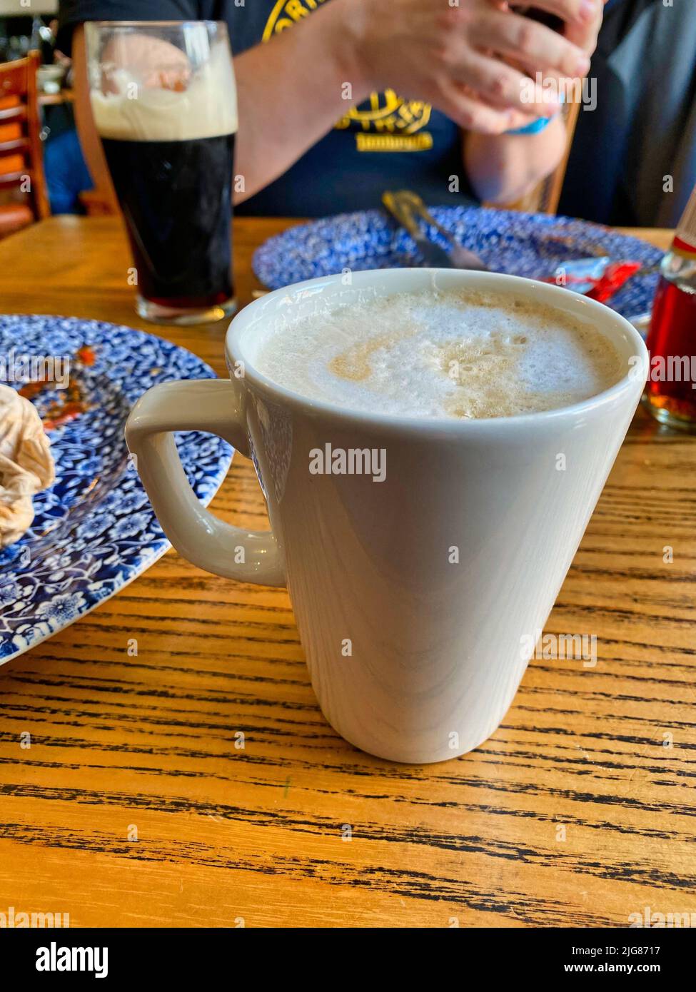 Coffee and pint in a restaurant Stock Photo - Alamy