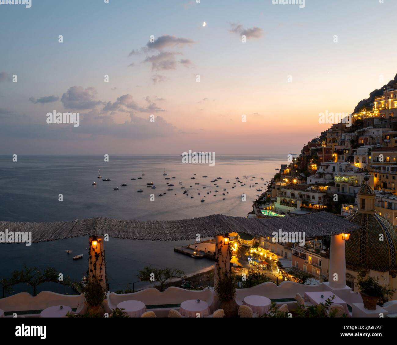 A scenic view of the beautiful village of Positano with illuminated ...