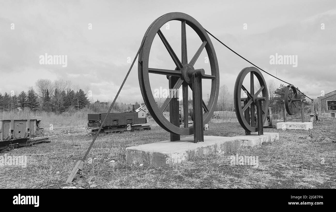 A grayscale shot of the wheels in the abandoned copper mine. Michigan ...