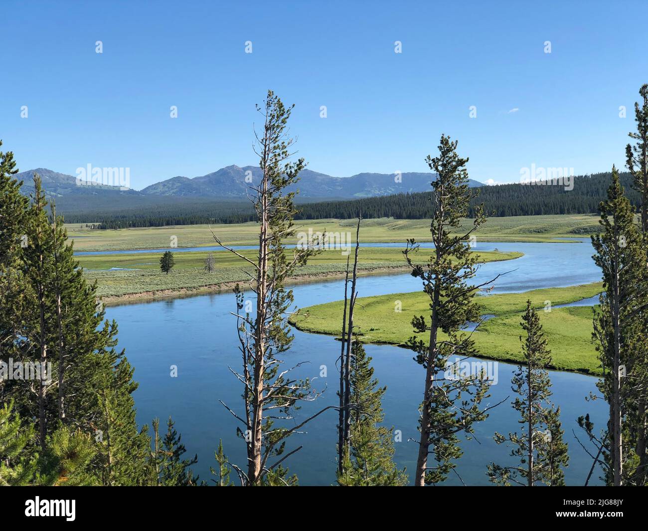 An aerial view of a beautiful lake near the mountains in summer Stock ...