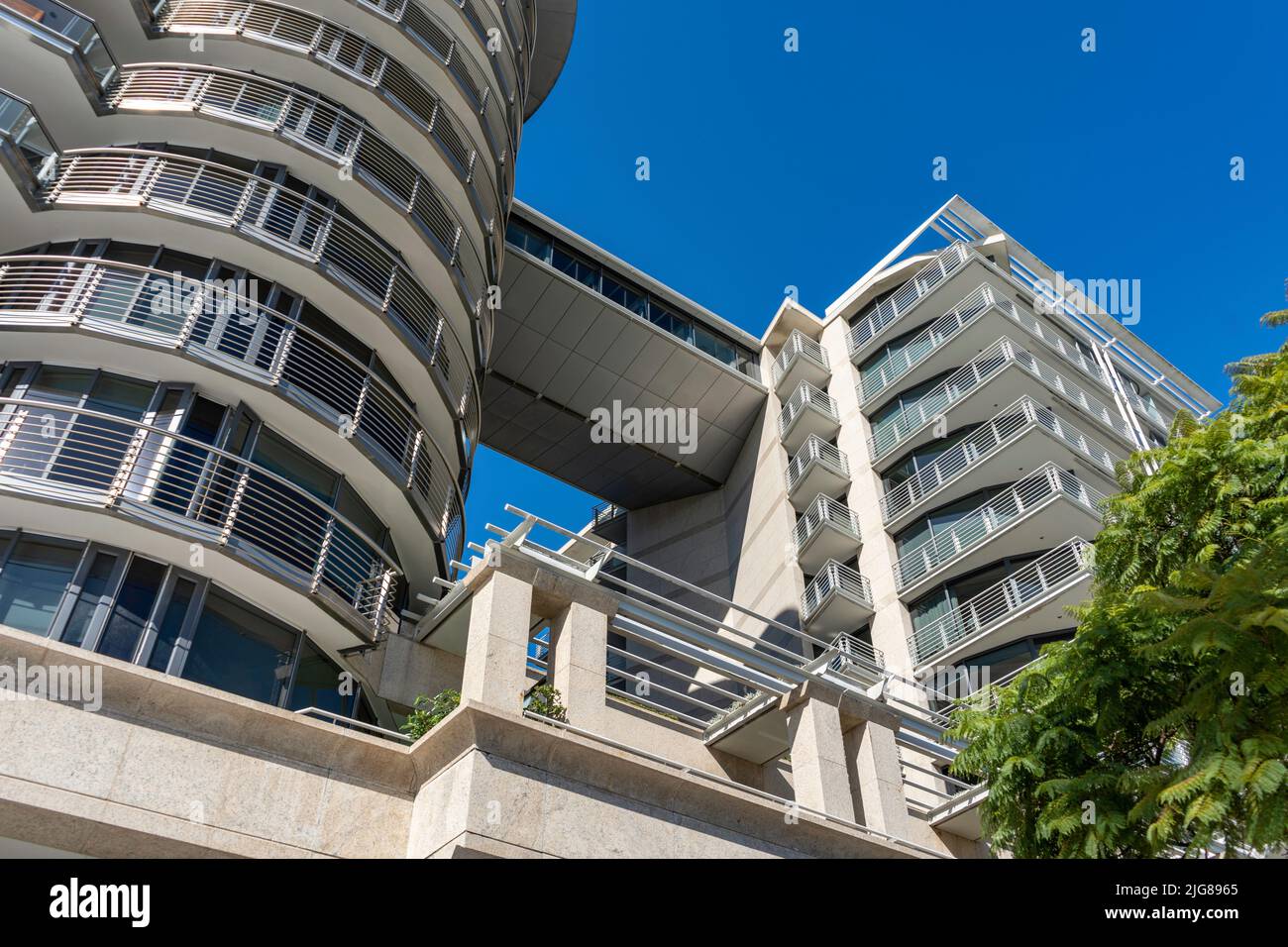 A residential building connected to another building with a bridge ...