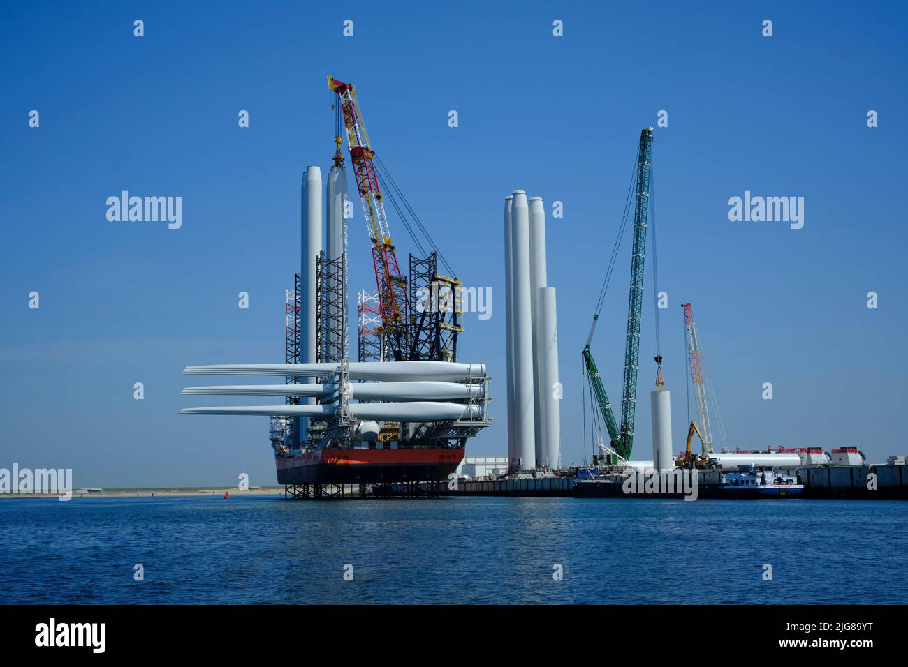 A large offshore vessel with a crane and a helipad is moored in the ...