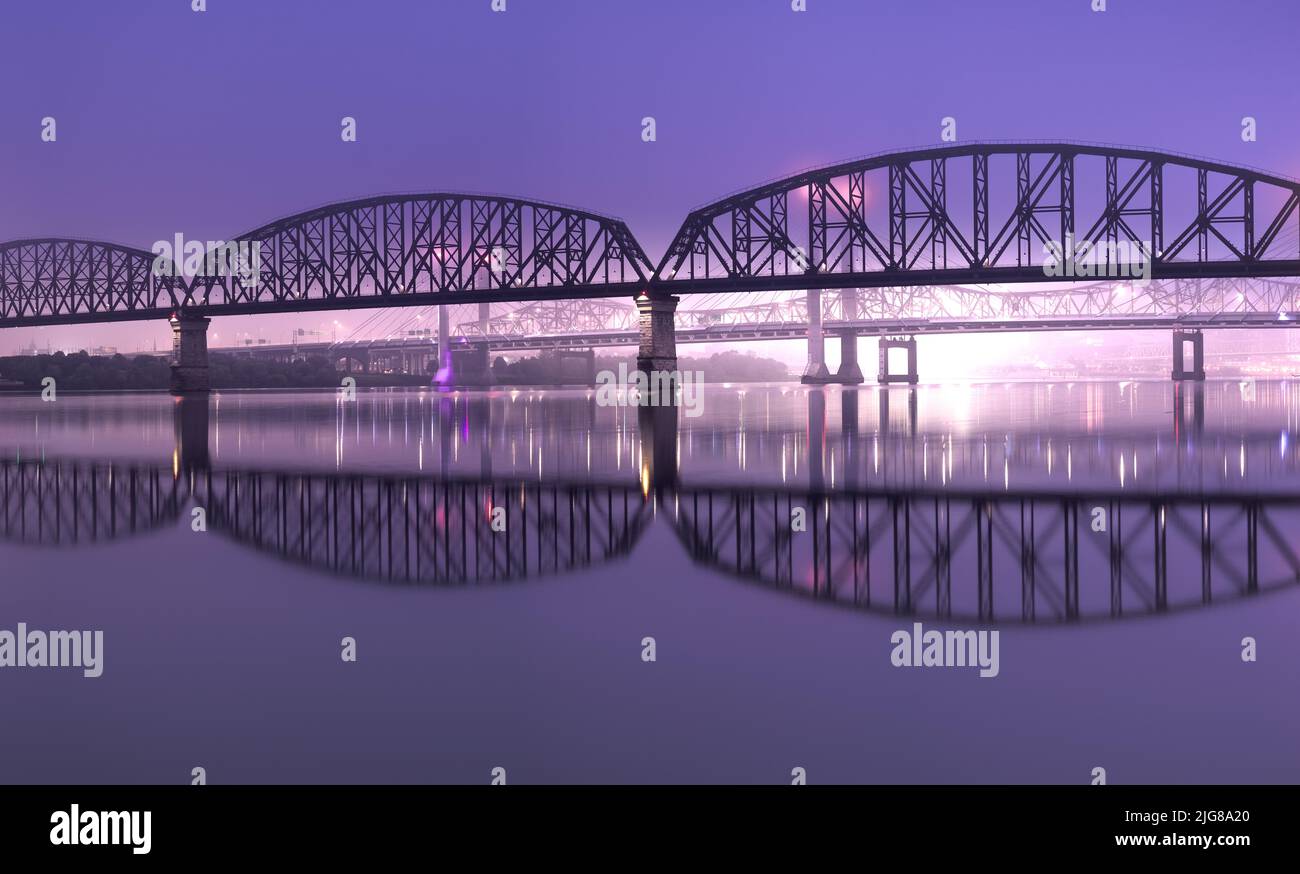 An aerial view of Big Four Bridge with reflection in purple background ...