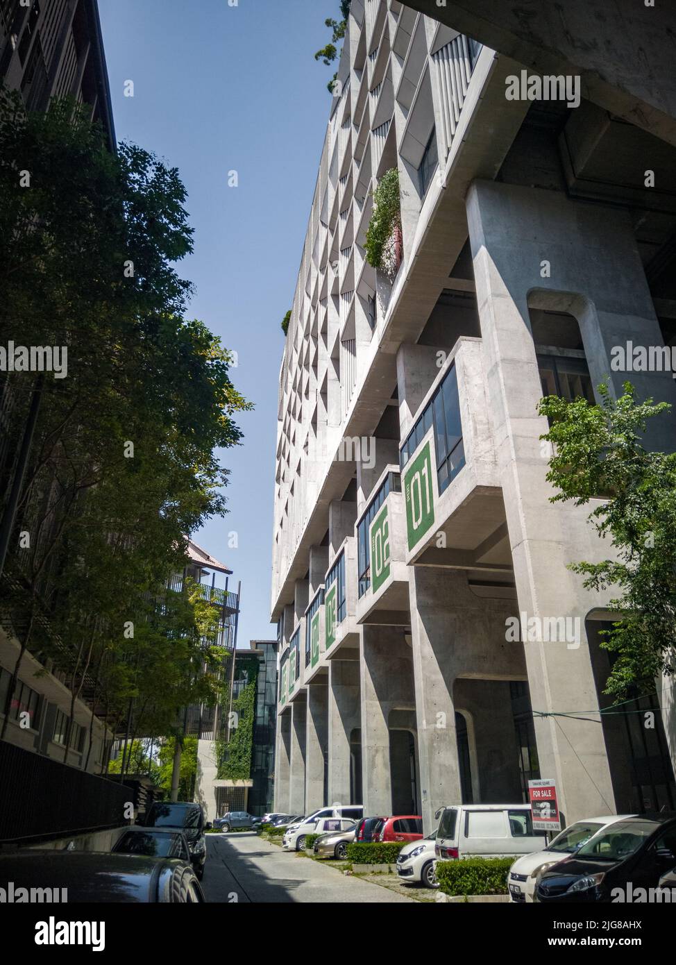 A vertical shot of the modern building in the Tamarind Square ...