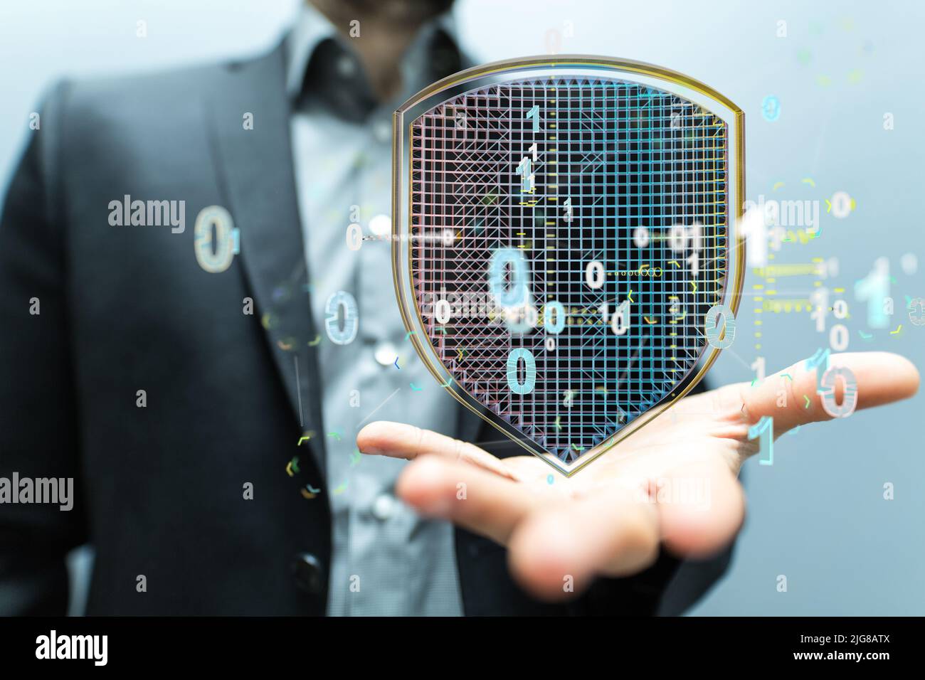 A closeup of a man holding a shield symbol - cybersecurity and ...