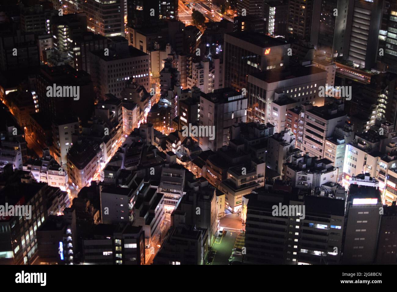 An aerial view of urban illuminated buildings at night Stock Photo - Alamy