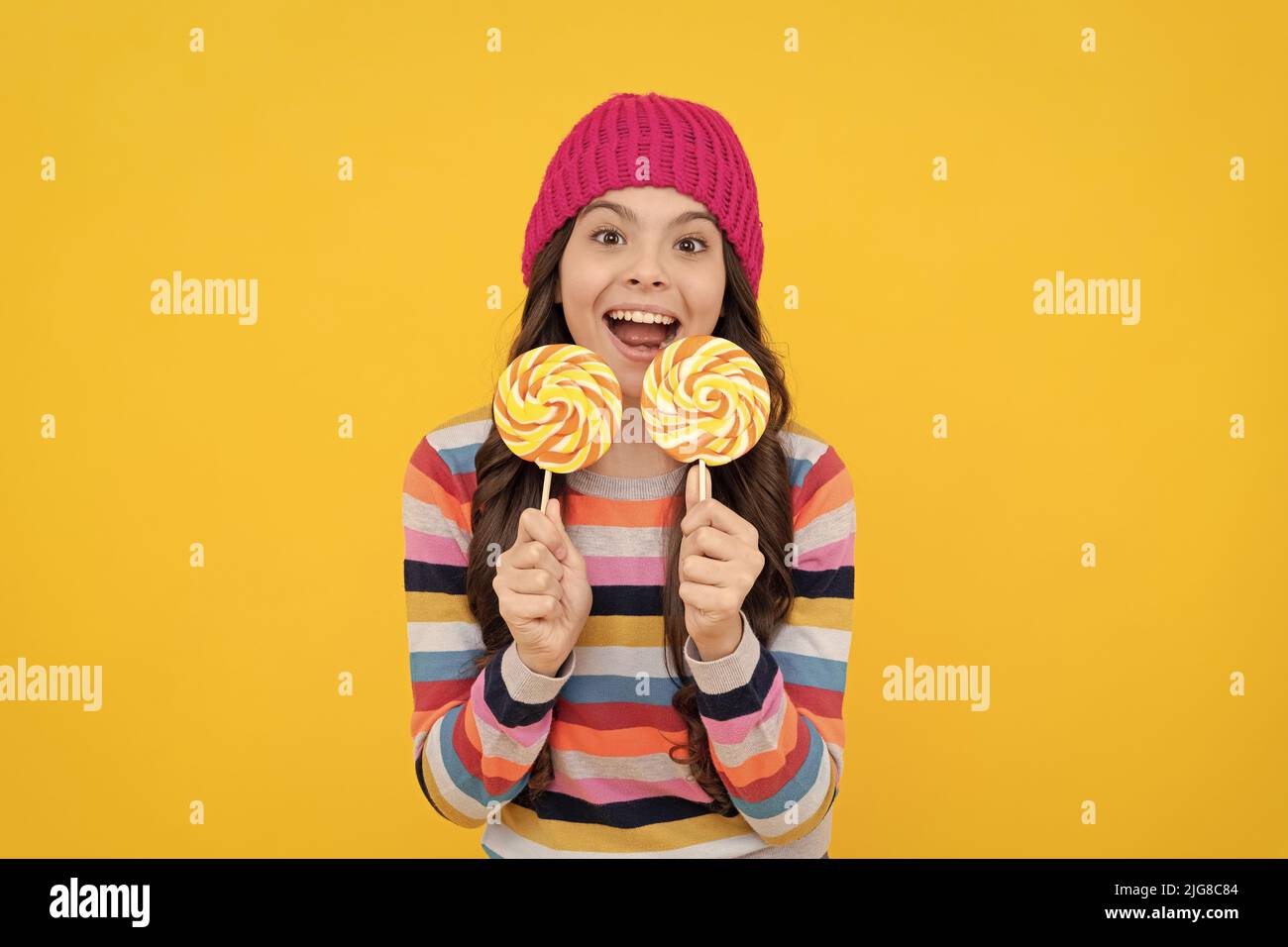 wow. happy teen girl hold lollipop. lollipop lady. hipster kid with colorful lollypop sugar ...