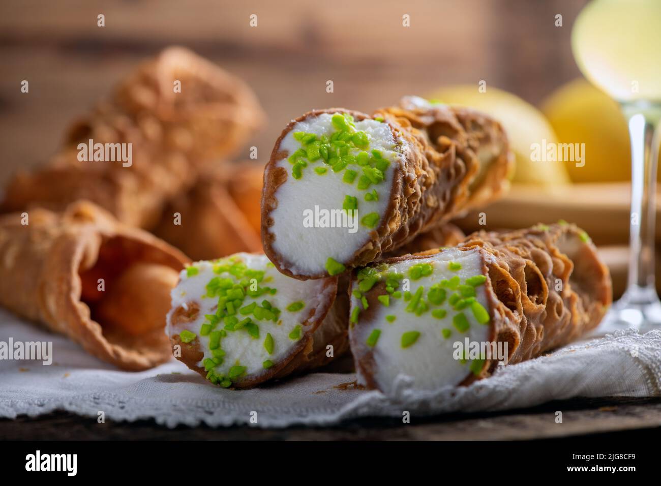 Freshly baked sicilian Cannoli dusted with powdered sugar close up ...