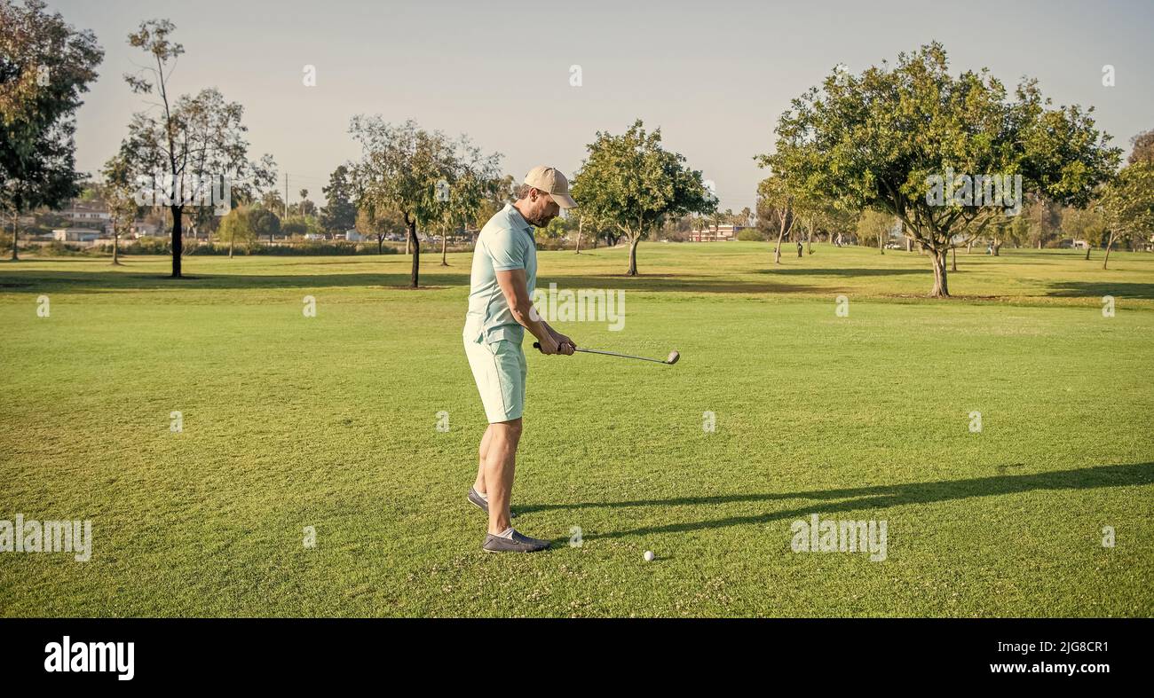 man playing golf game on green grass, sport Stock Photo - Alamy