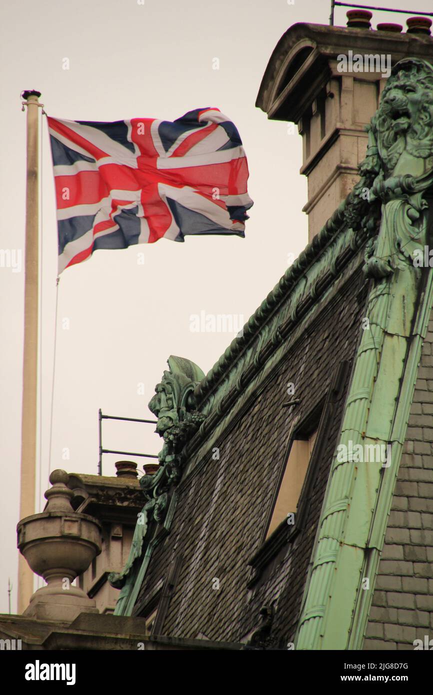 A vertical shot of Great Britain flag hanging from flag pole Stock ...