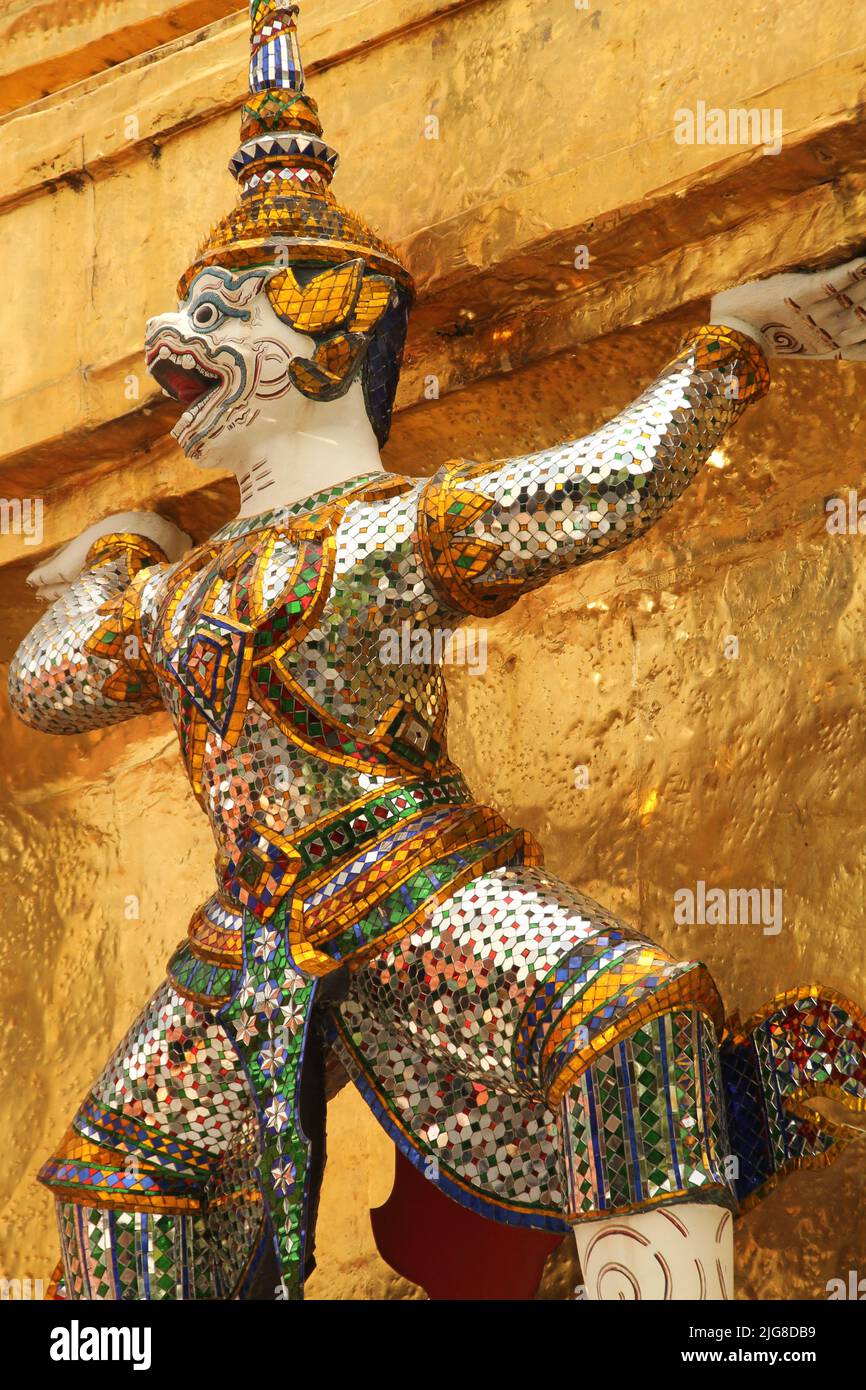 The vertical shot of the statue of Yaksha in the Bangkok Buddhist ...