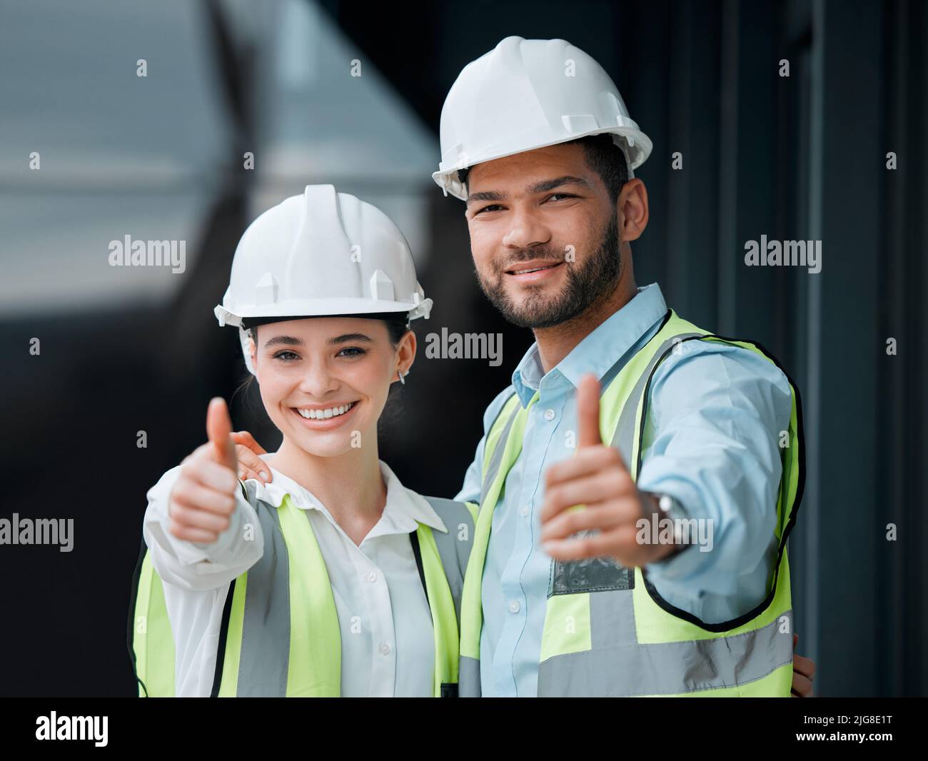 Your building plans have been approved. Cropped portrait of two young ...