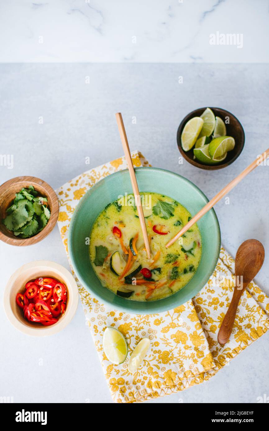 A top view of Thai coconut soup with garnishes Stock Photo - Alamy