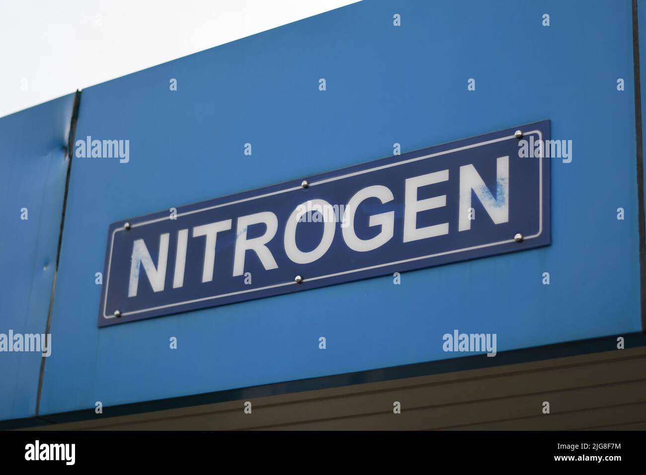 A closeup shot of a nitrogen board sign on a gas station wall Stock ...