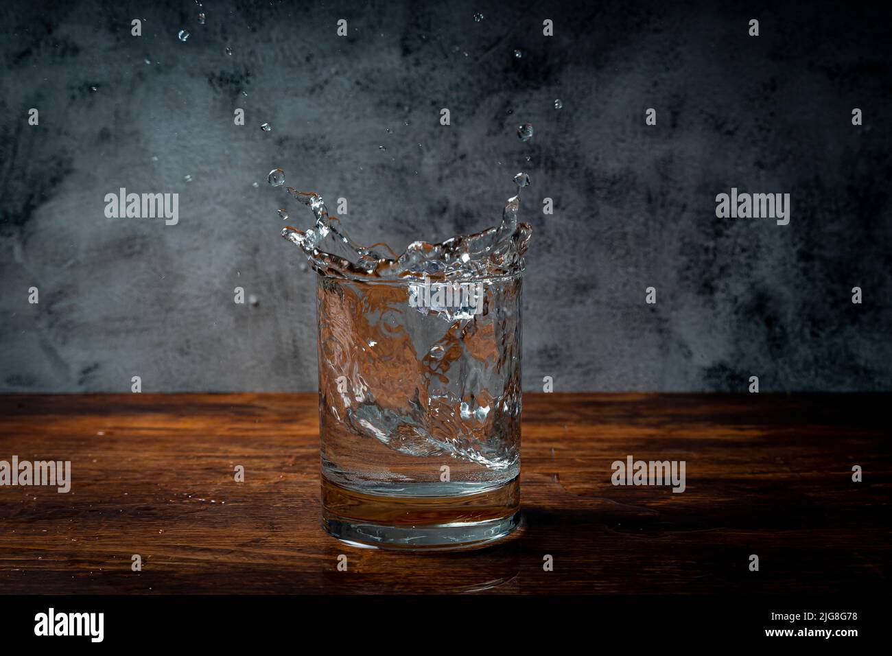 ice cubes fall into a glass Stock Photo - Alamy
