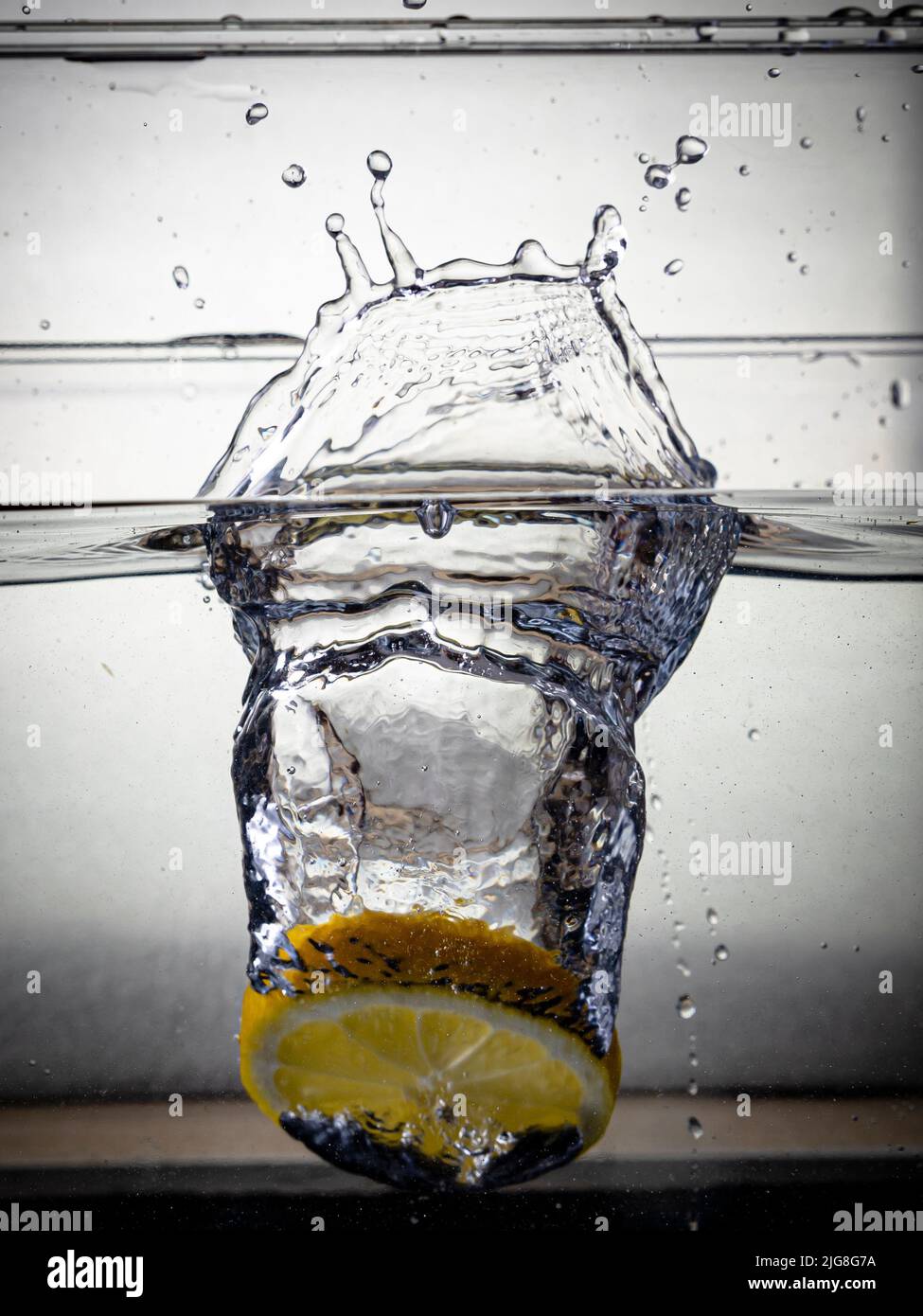fruit fall into a glass splash Stock Photo - Alamy