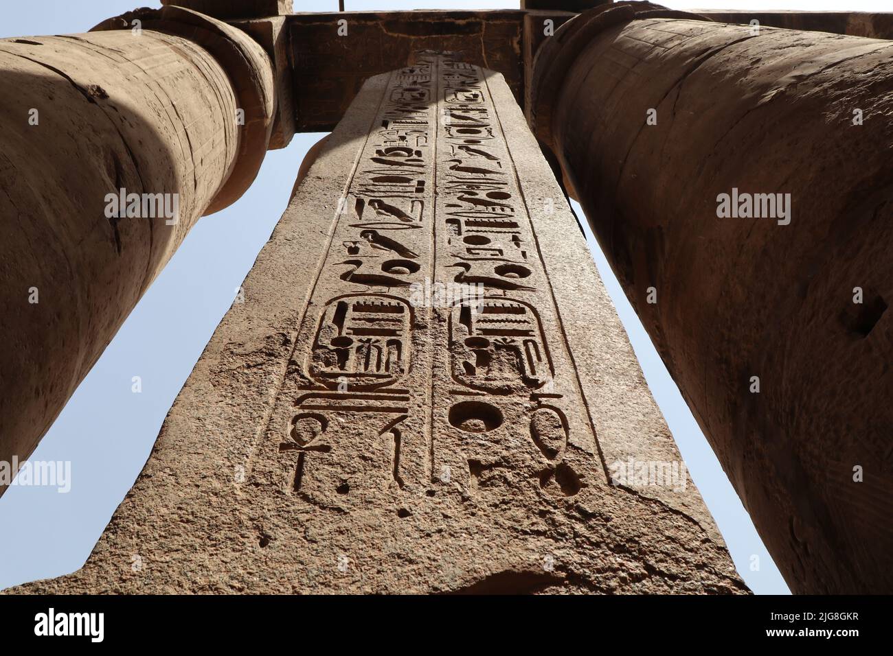 A low-angle shot of ancient Egyptian hieroglyphs engraved in a stone ...