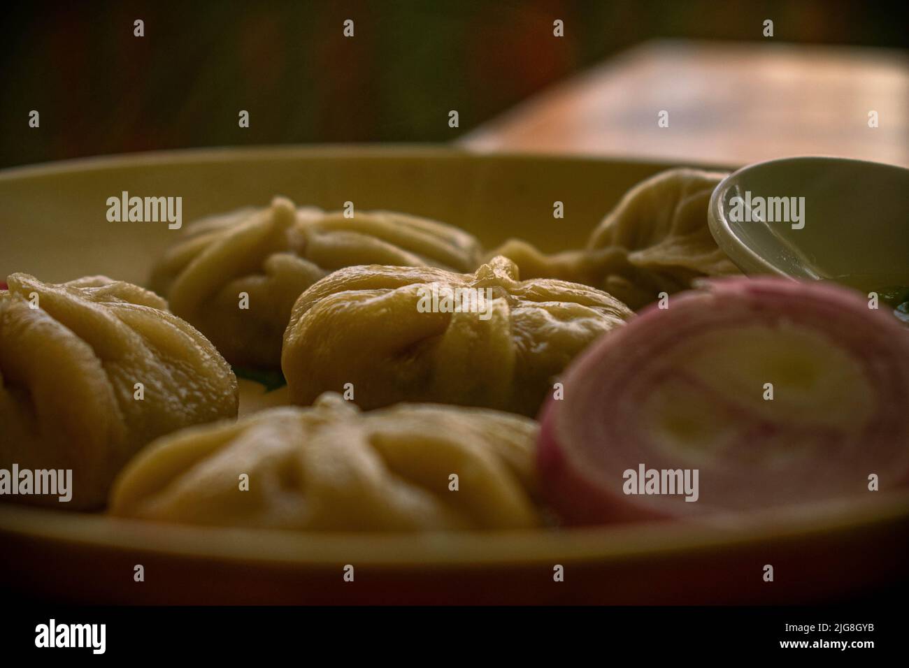 A closeup shot of momo dumplings on a blurry background Stock Photo - Alamy