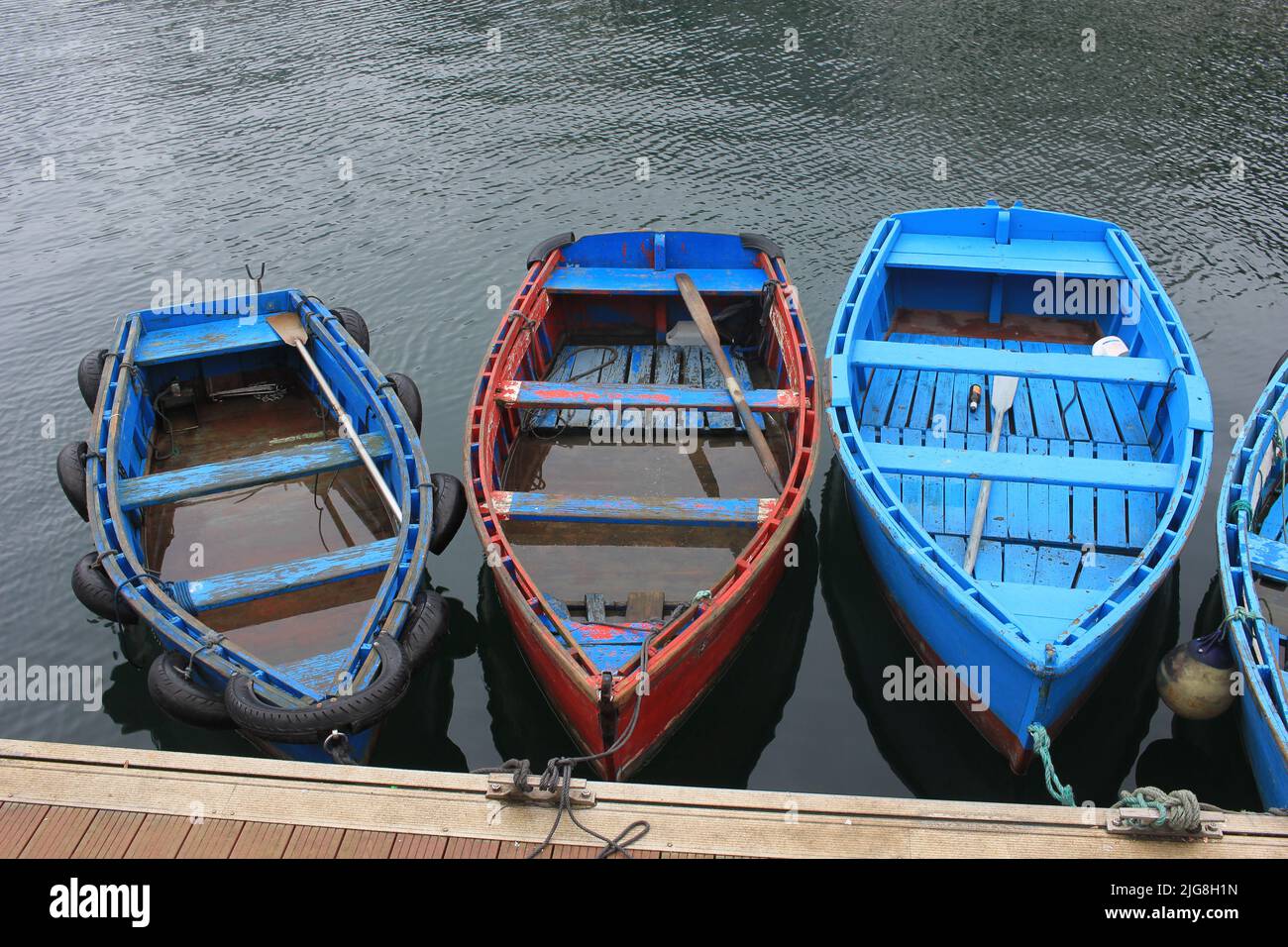 small boats in a sad, rainy, summer sunday Stock Photo - Alamy