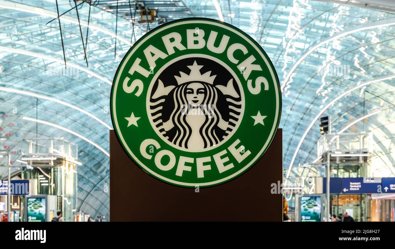 starbucks coffee sign at the train station Stock Photo - Alamy
