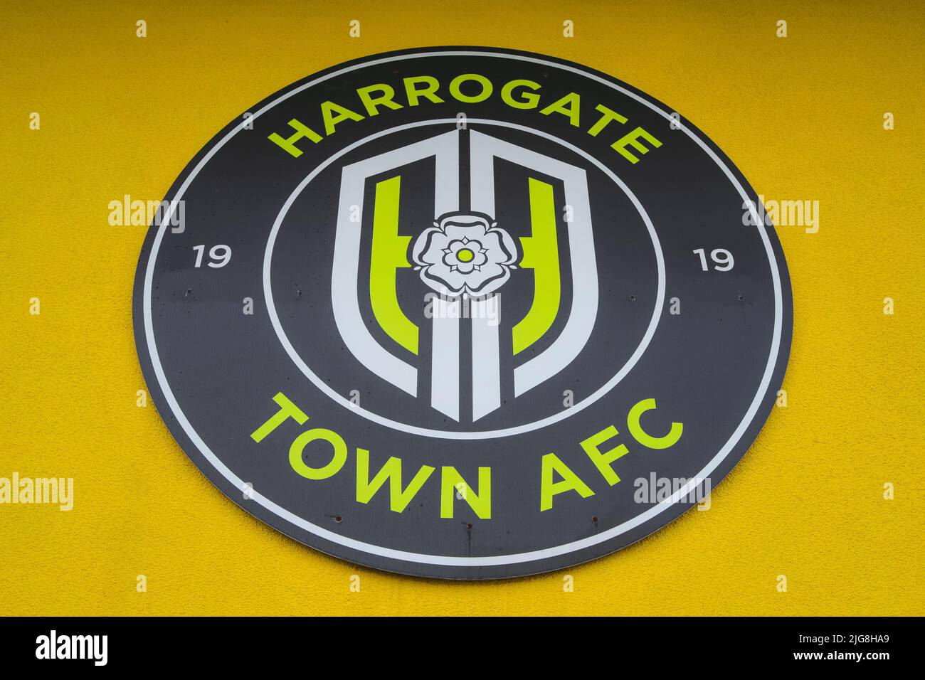 The Harrogate Town AFC badge on The CNG Stadium ahead of this evening's ...