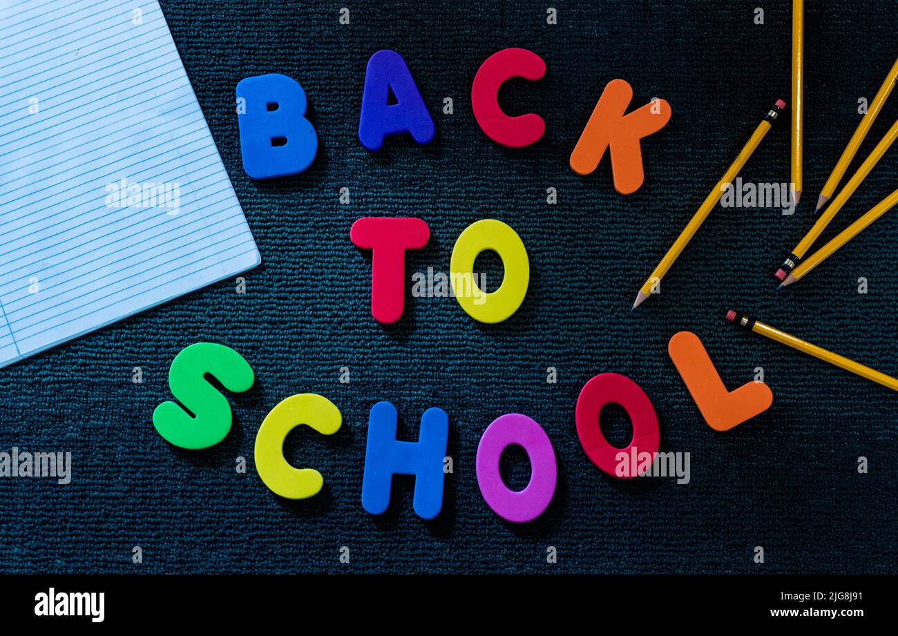 Back to school colored sign with paper and pencils Stock Photo - Alamy