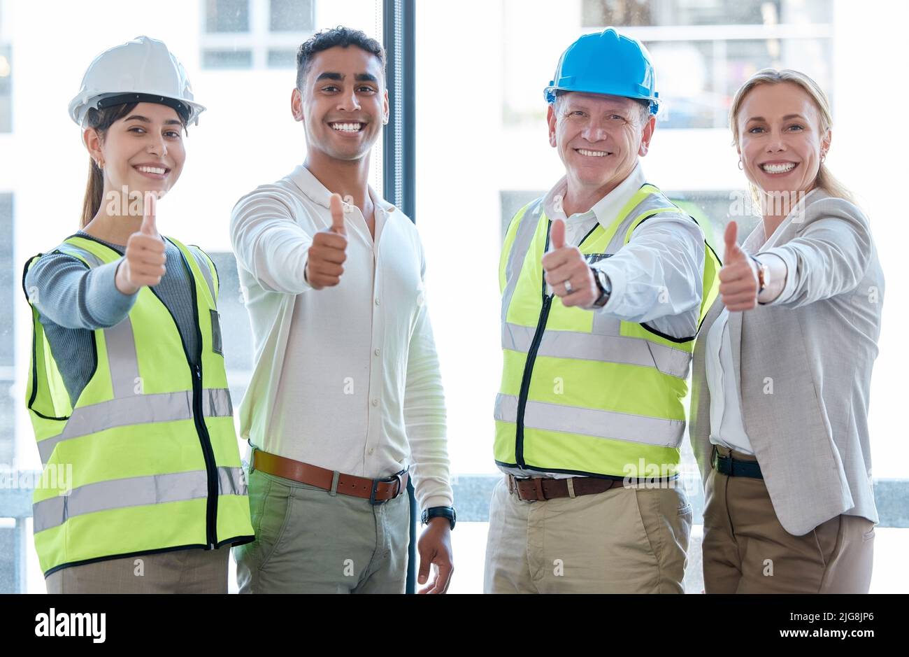 Backing the build. Cropped portrait of four construction workers giving ...