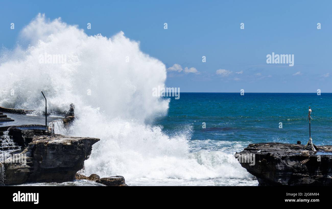 A beautiful shot of the ocean's waves washing over the rocks Stock ...