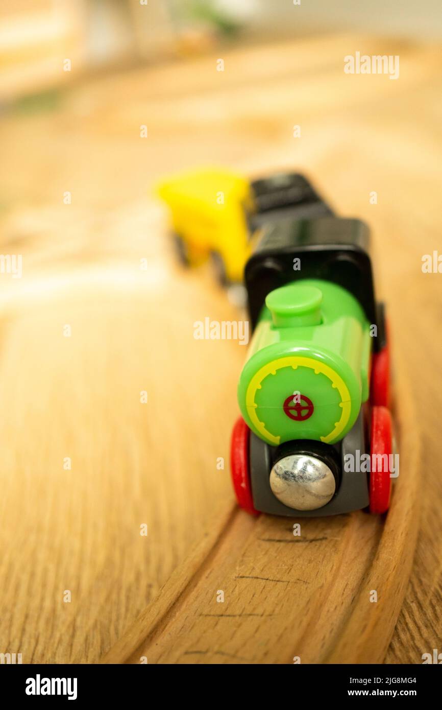 A vertical view of a choo choo train toy on the wooden surface Stock ...