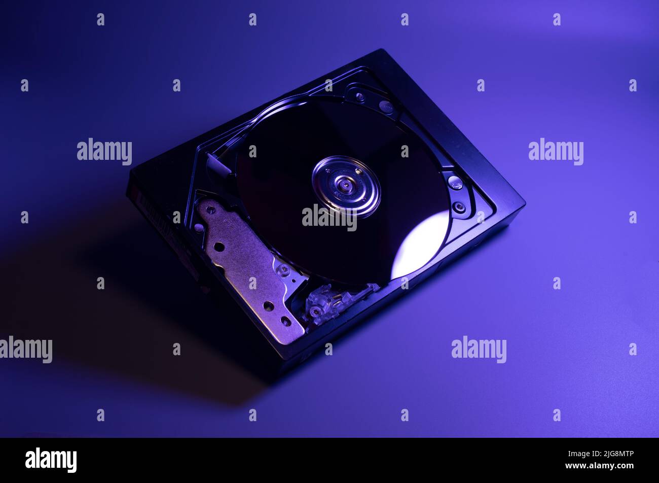 A Close up of hard disk with blue background Stock Photo - Alamy
