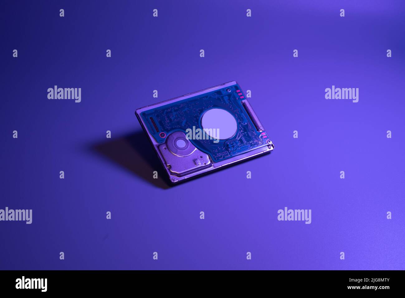 A Close up of hard disk with blue background Stock Photo - Alamy
