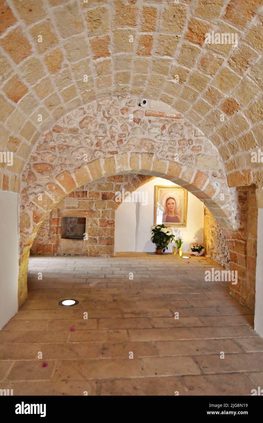 An alley in Specchia, a medieval village in the Puglia region of Italy ...