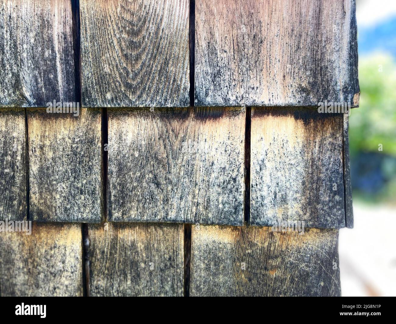 Closeup old weathered bavarian wall planked with bright natural square ...