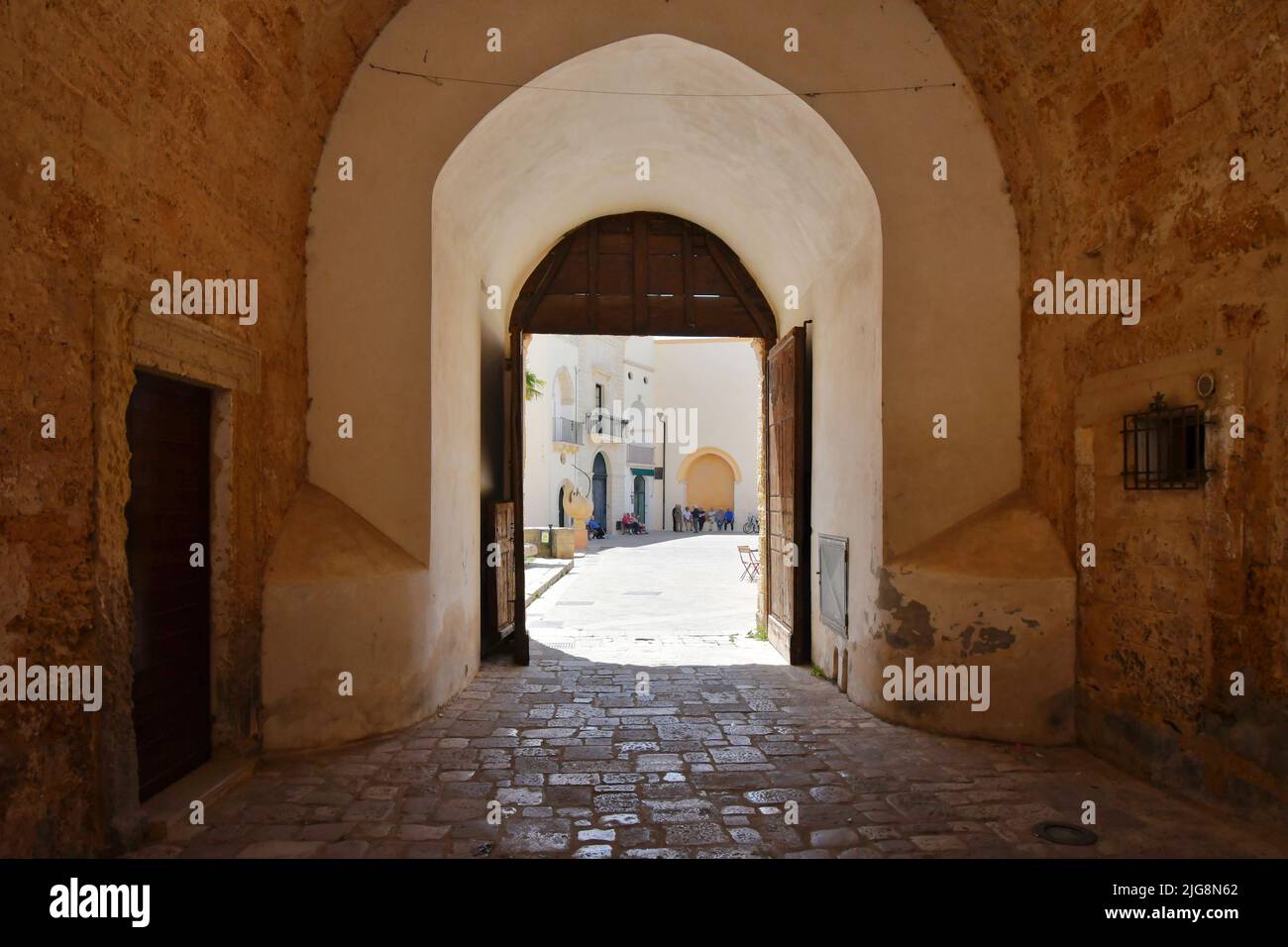 An alley in Specchia, a medieval village in the Puglia region of Italy ...