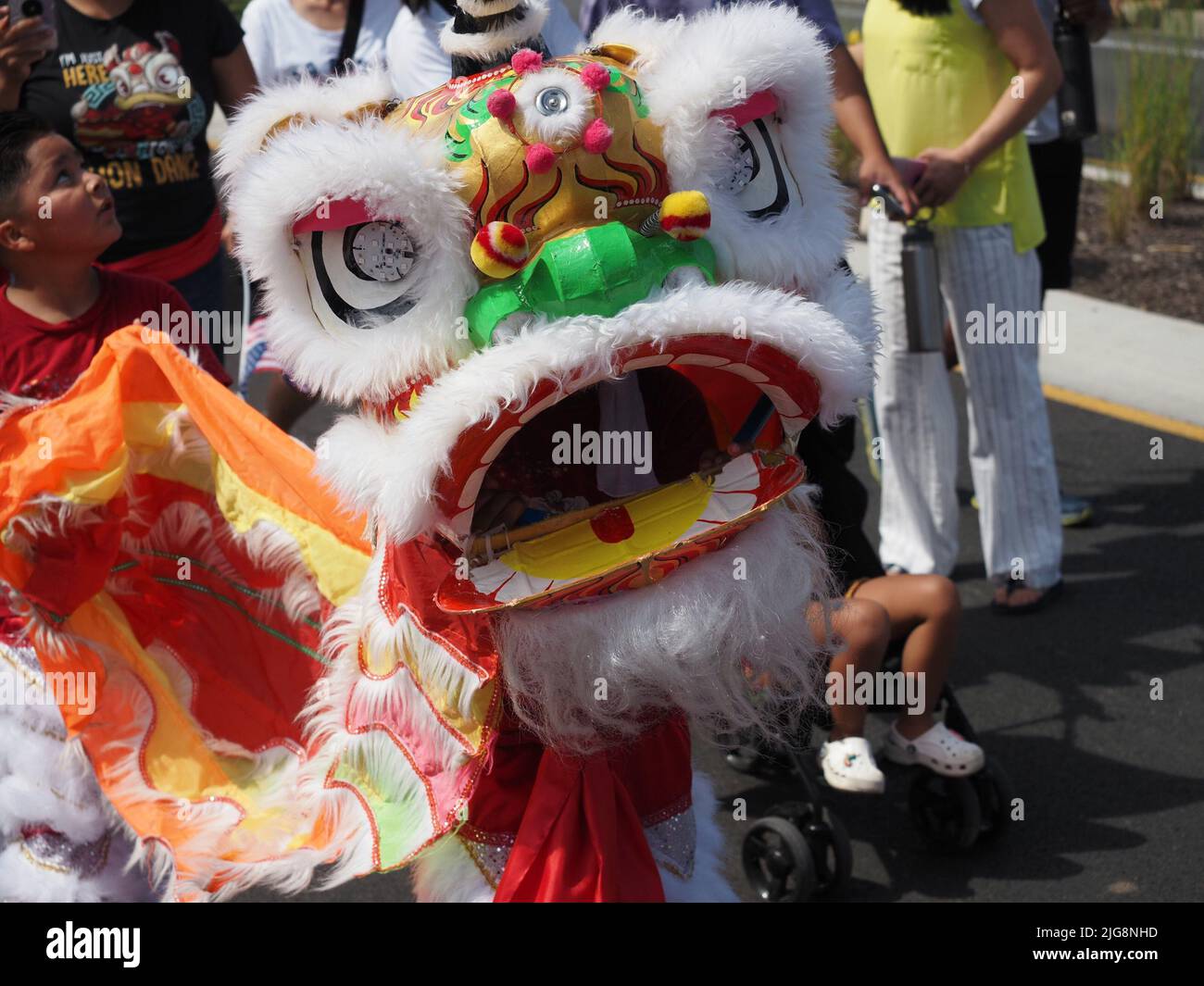 Chinese Dragon entertaining spectators in Parade. Selective focus and ...