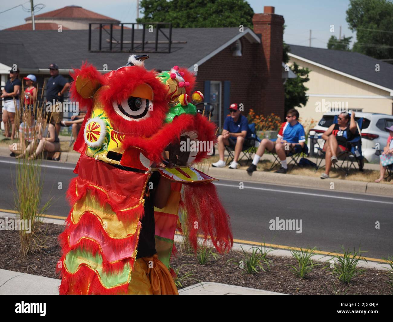 Chinese Dragon entertaining spectators in Parade. Selective focus and ...