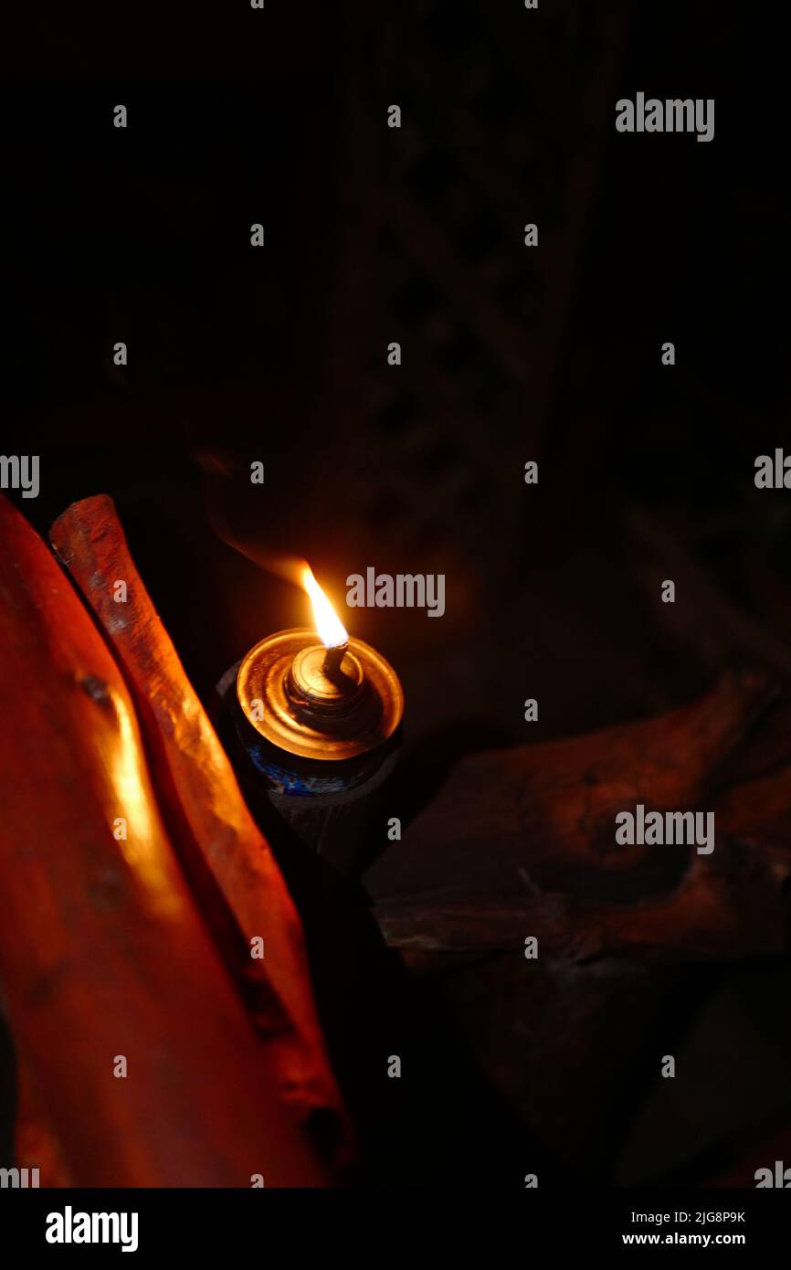 A vertical shot of a metal jar with a burning fire on top Stock Photo ...