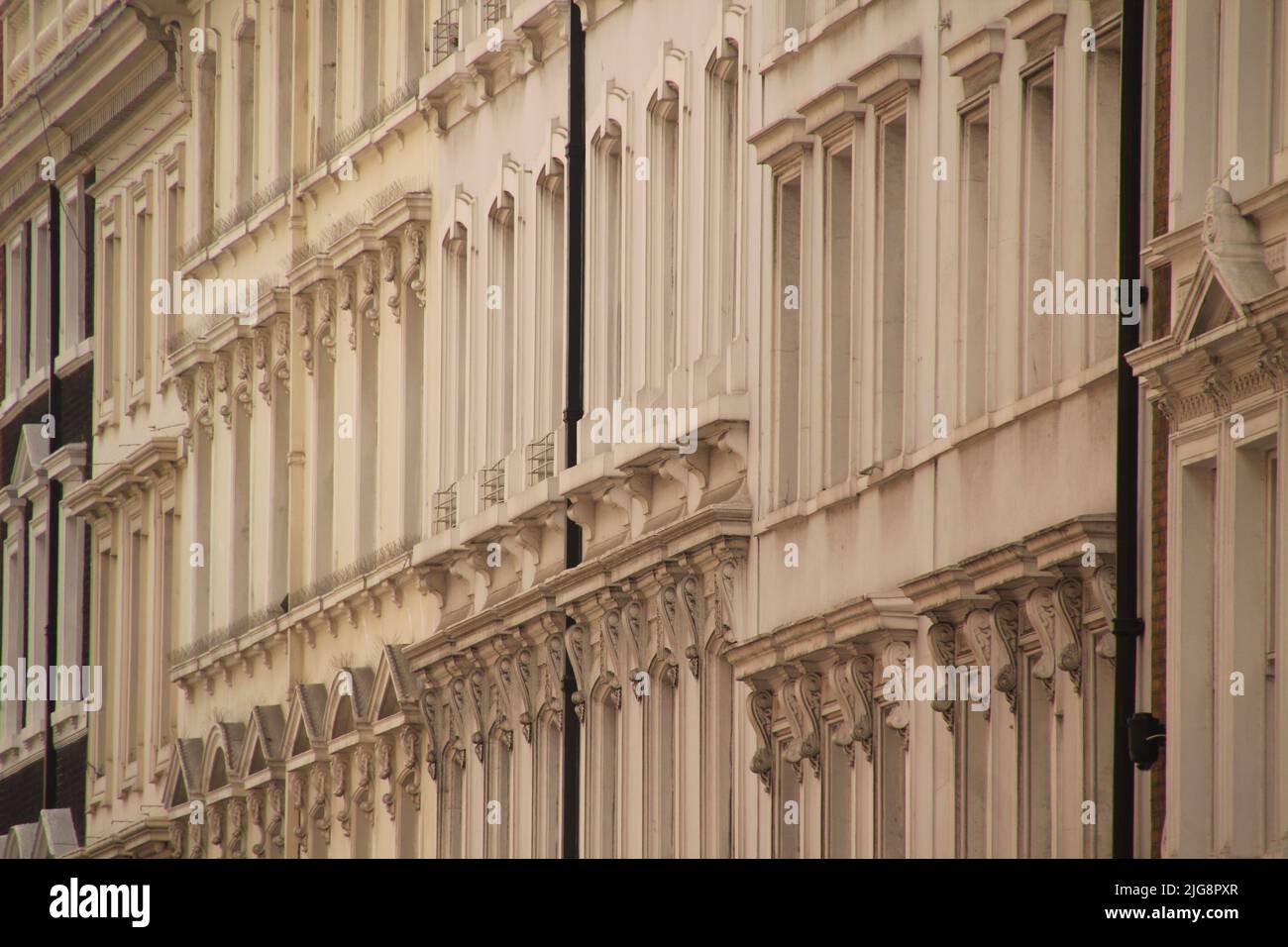 A white building facade in London Stock Photo - Alamy