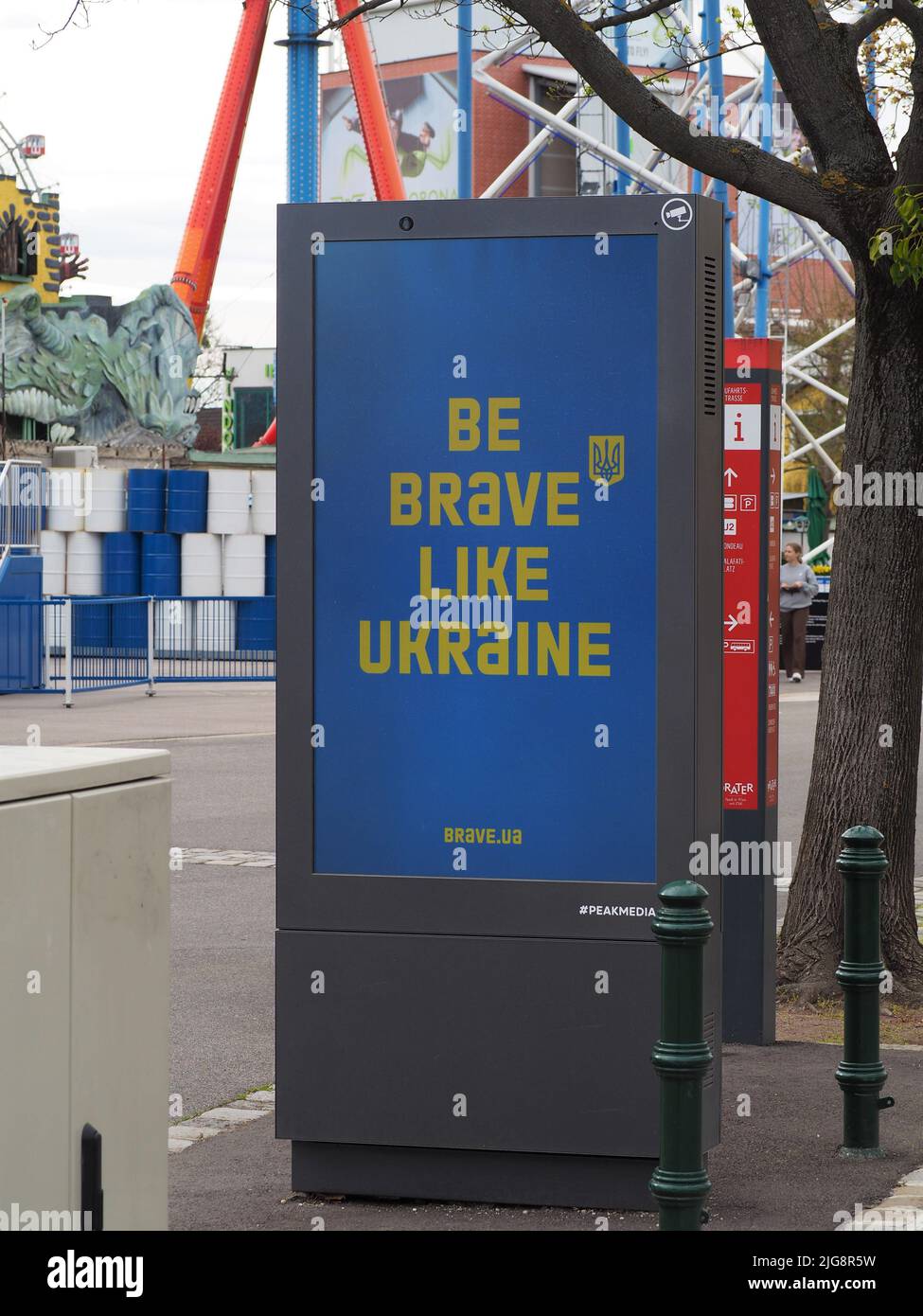 A street advertisement with text "Be Brave Like Ukraine Stock Photo - Alamy