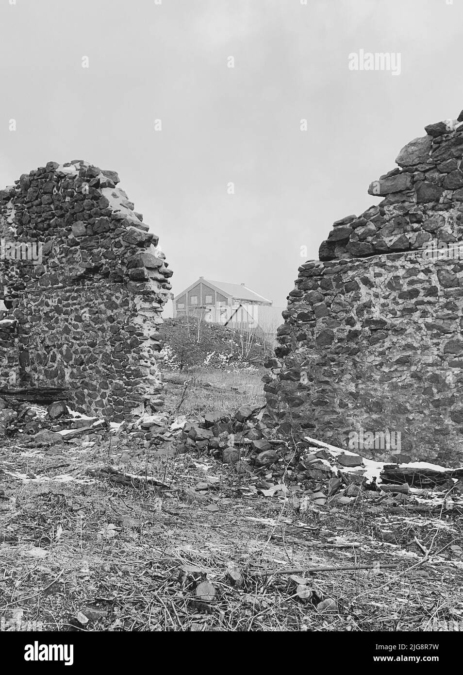 A vertical shot of left copper mine buildings with two half-destroyed ...