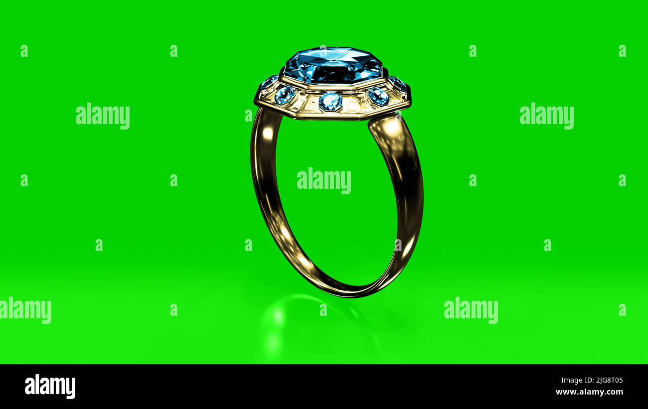 goldish ring with blue topaz gem on green screen, isolated, fictive ...