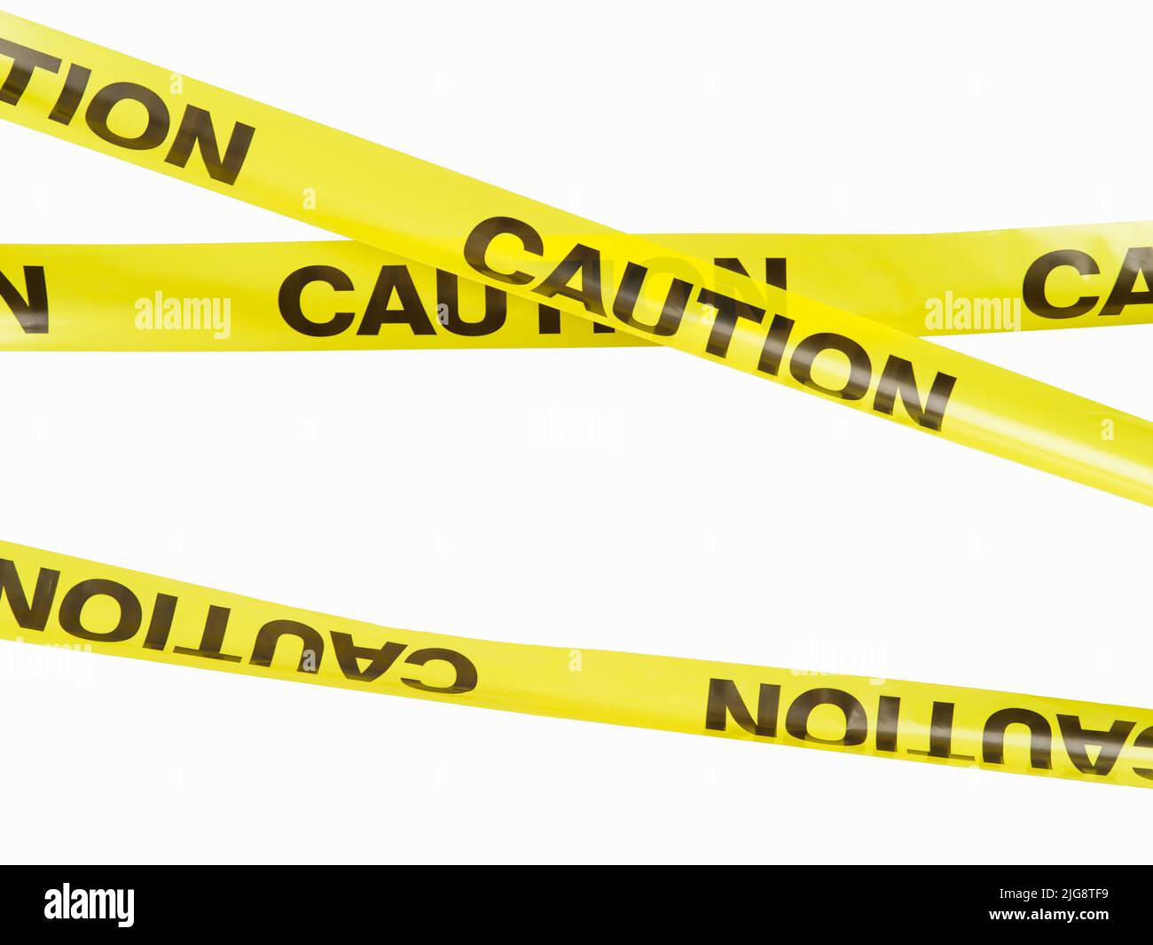 Yellow warning plastic tapes with black inscription - caution. Abstract ...