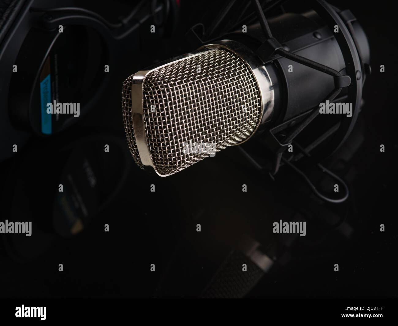 Professional studio microphone on a black background. Close-up ...