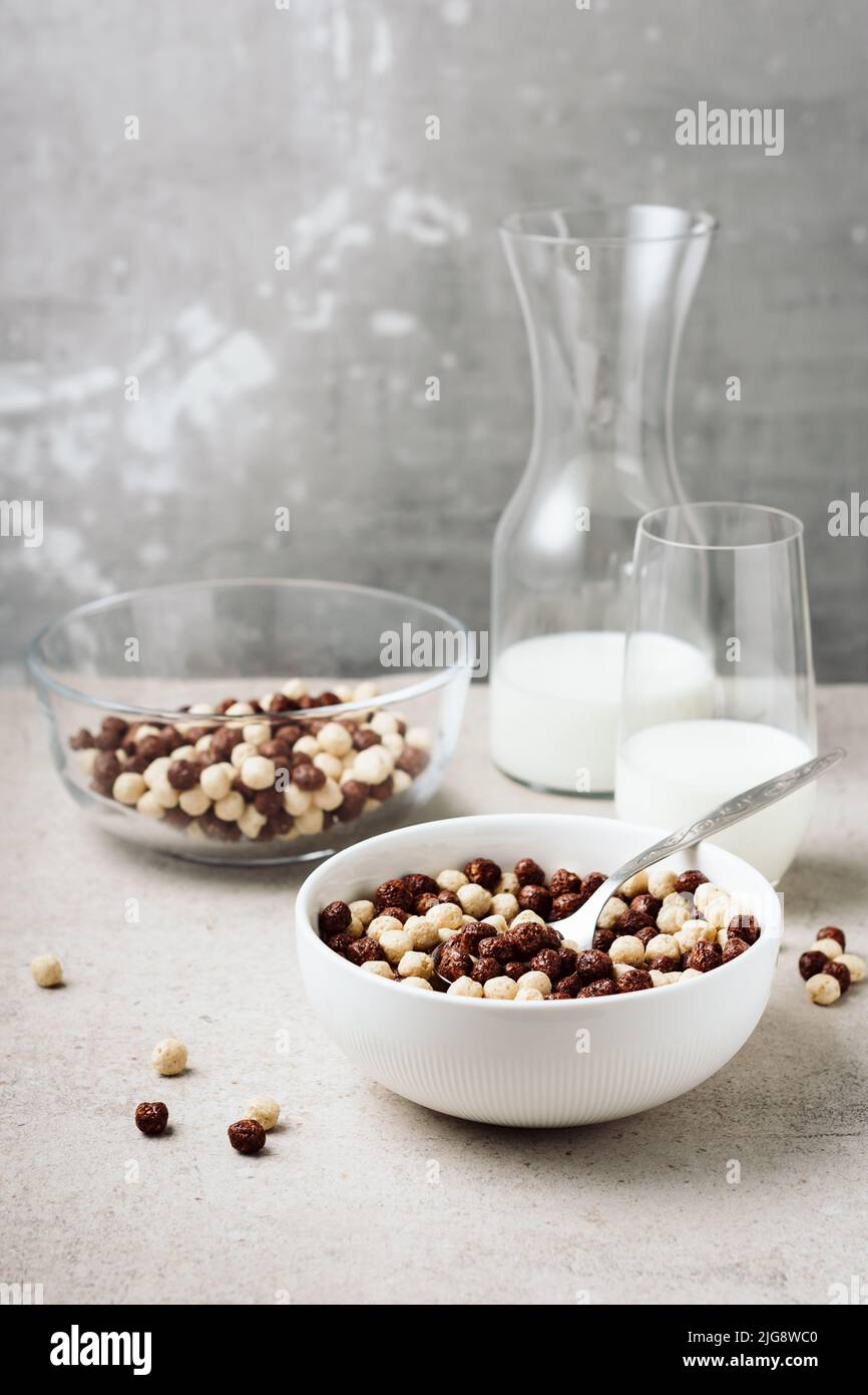 Breakfast cereal balls and milk on a wooden table Stock Photo - Alamy