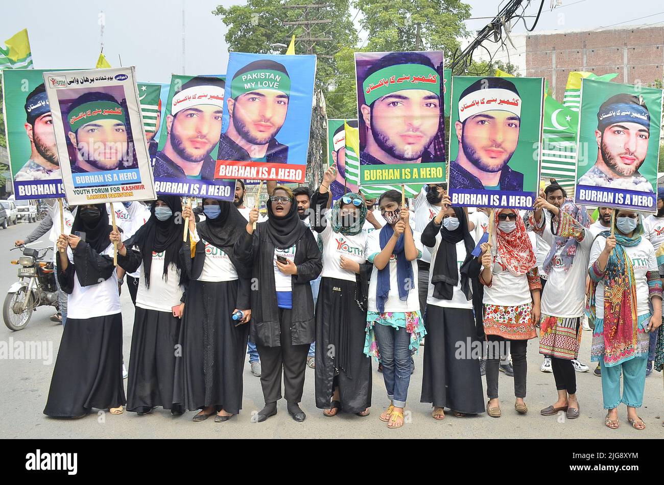 Pakistani activists of Youth Forum for Kashmir hold placards featuring ...