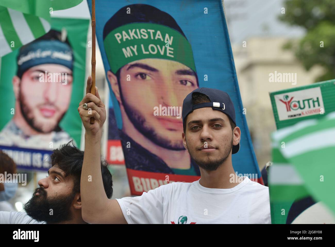 Pakistani activists of Youth Forum for Kashmir hold placards featuring ...