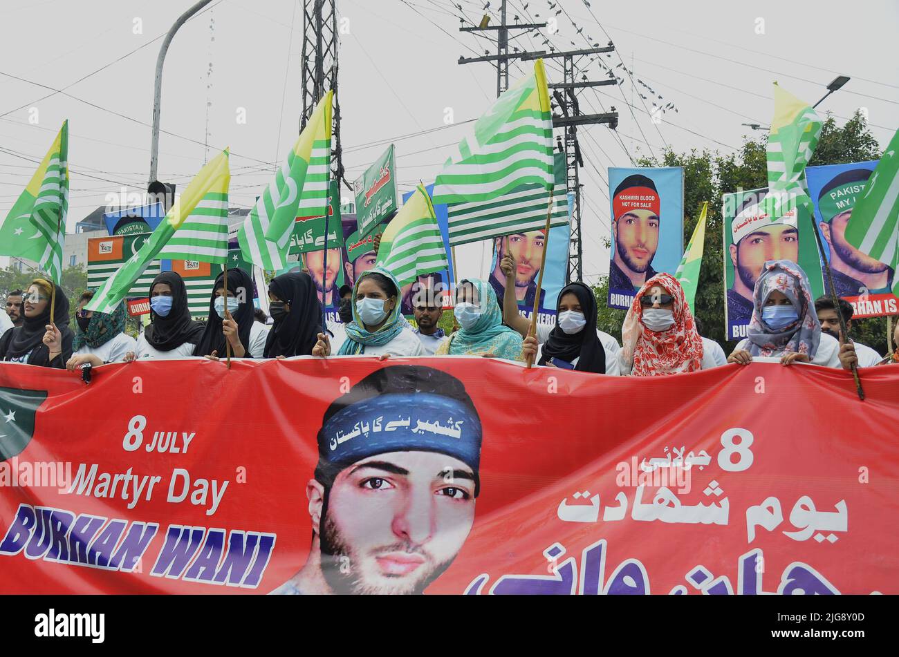 Pakistani activists of Youth Forum for Kashmir hold placards featuring ...